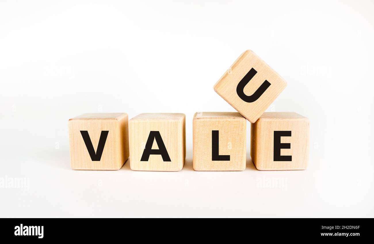Value symbol. The concept word 'value' on wooden cubes on a beautiful ...