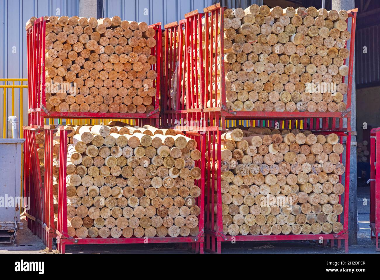 Short Wood Logs Without Bark Stack at Rack Frame Stock Photo - Alamy