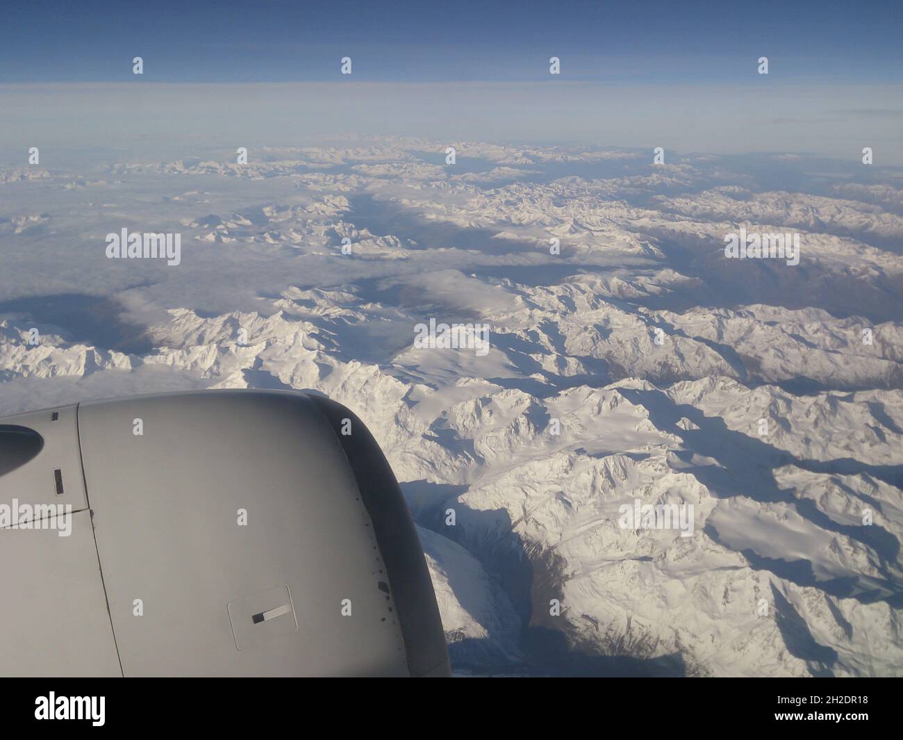 Jet engine with snowcapped alps in background Stock Photo - Alamy