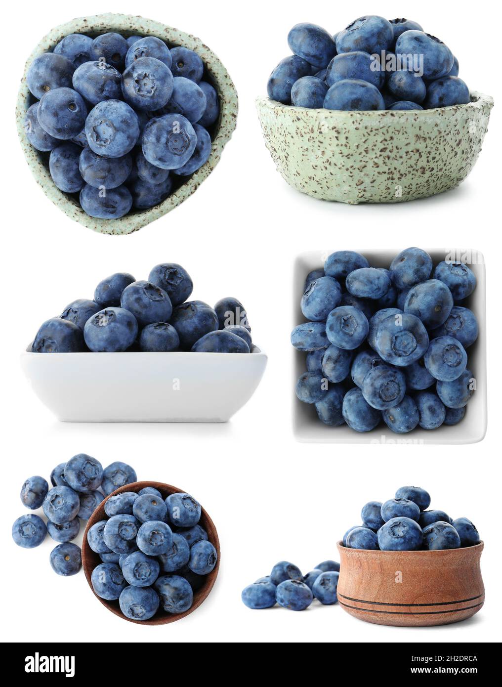 Set with fresh tasty blueberries in bowls on white background Stock ...