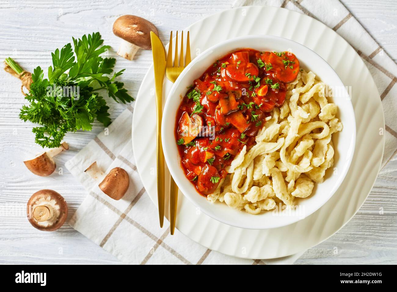 spaetzle with mushroom gravy in a white bowl, jagerspatzle ...