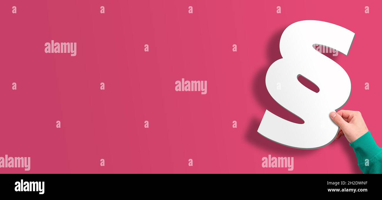 hand holding section sign against pink background with copy space Stock ...