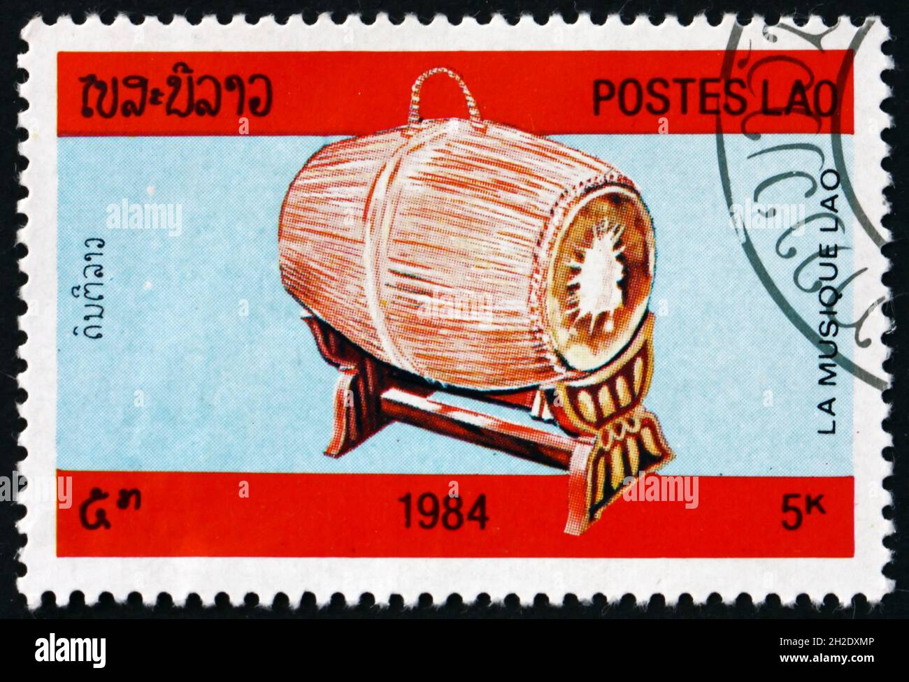 LAOS - CIRCA 1984: a stamp printed in Laos shows barrel drum, musical ...