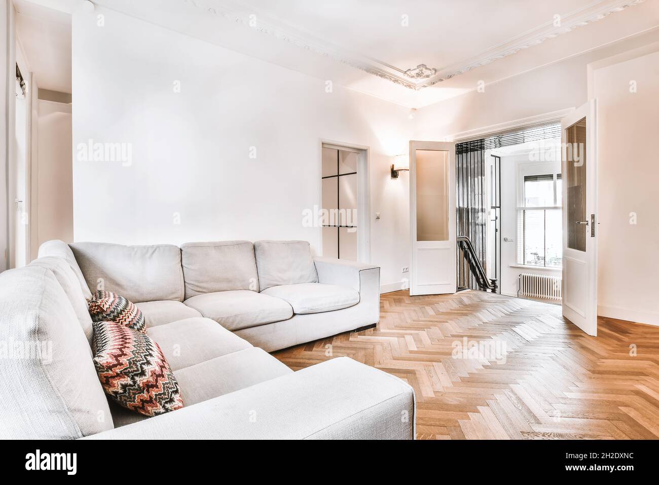 Stylish living room with the big sofa Stock Photo - Alamy