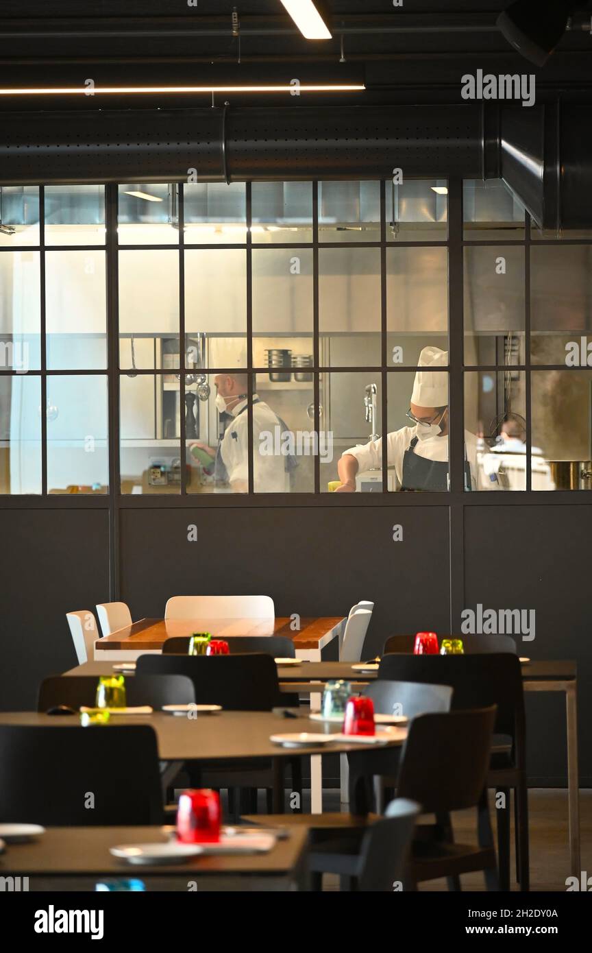 TURIN, ITALY - Sep 23, 2021: A beautiful restaurant interior with chefs ...