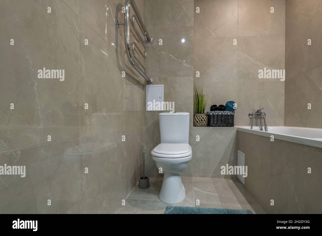 toilet and detail of a corner shower cabin with wall mount shower ...