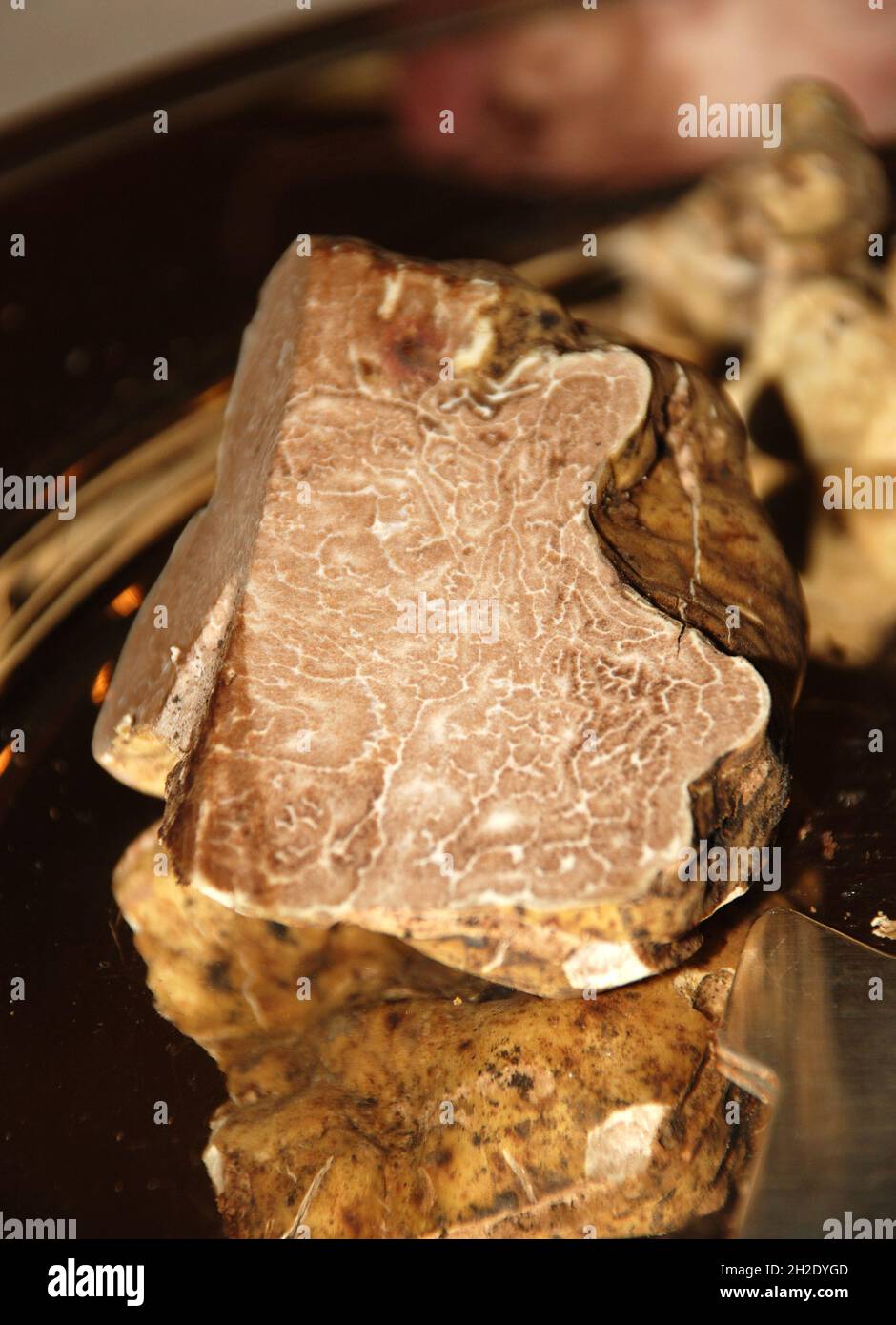 Vertical shot of sliced white truffles on a steel tray Stock Photo - Alamy