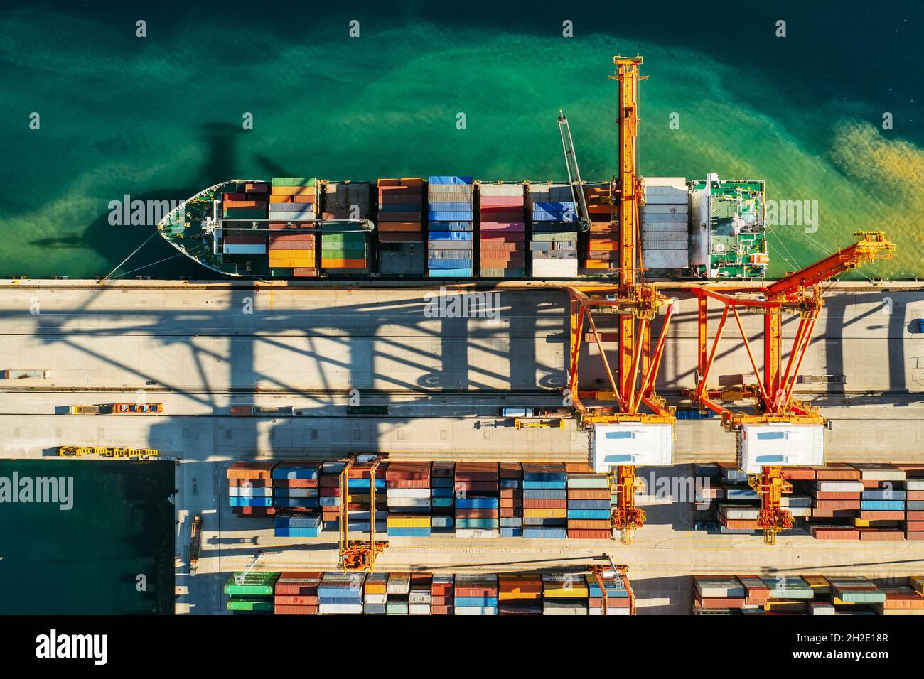 Aerial view of containers loading and unloading to the ship in the sea ...