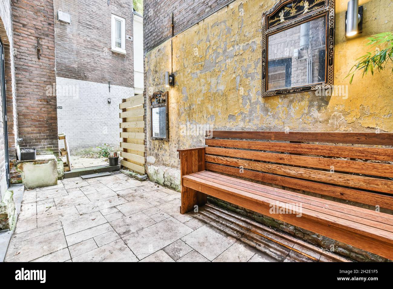Decoration in the beautiful veranda with benche and mirror Stock Photo ...