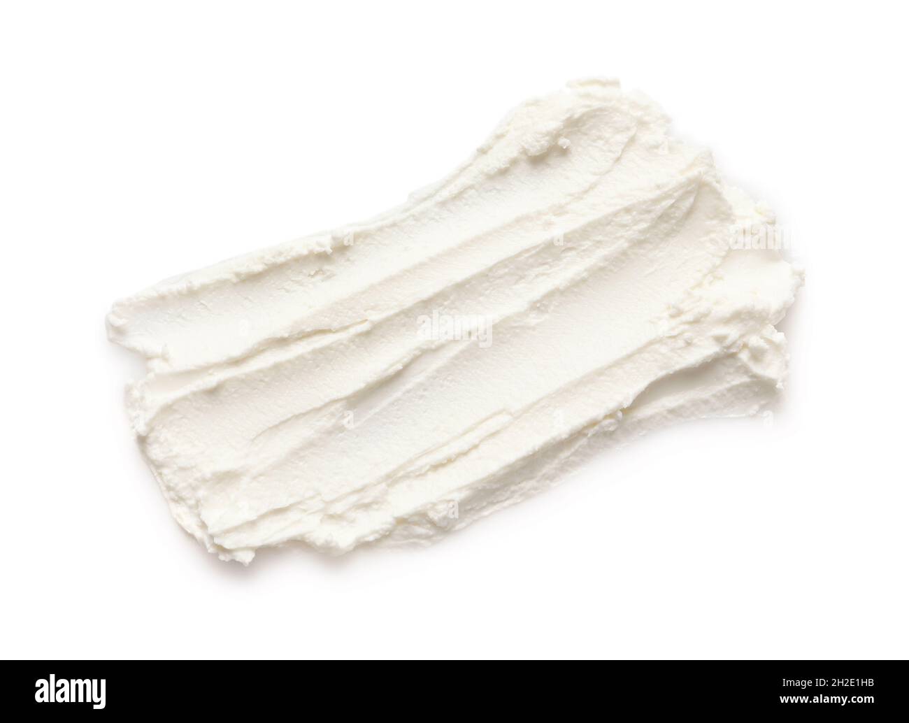 Smear of tasty cream cheese on white background, top view Stock Photo ...