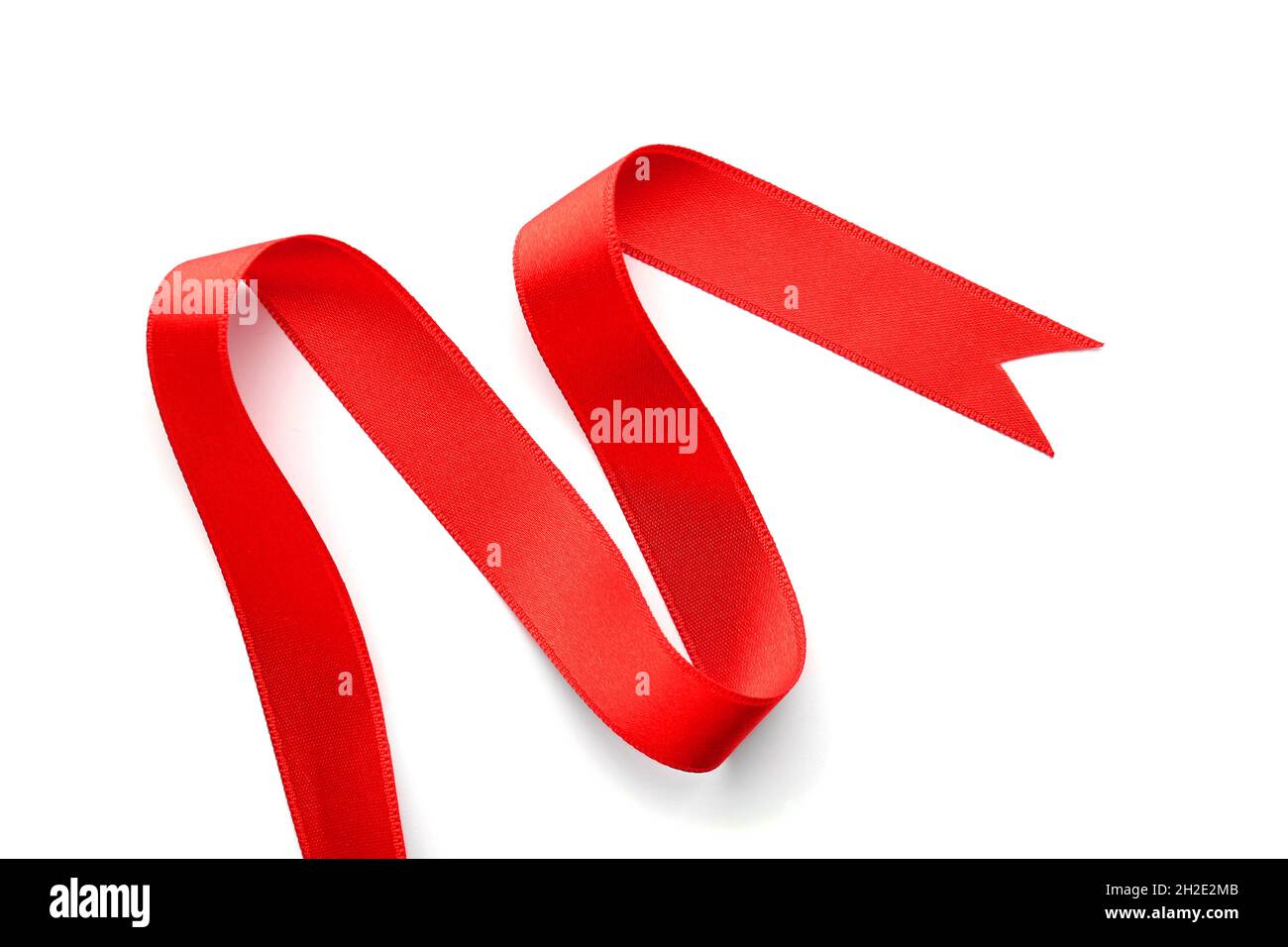 Simple red ribbon on white background, top view Stock Photo - Alamy