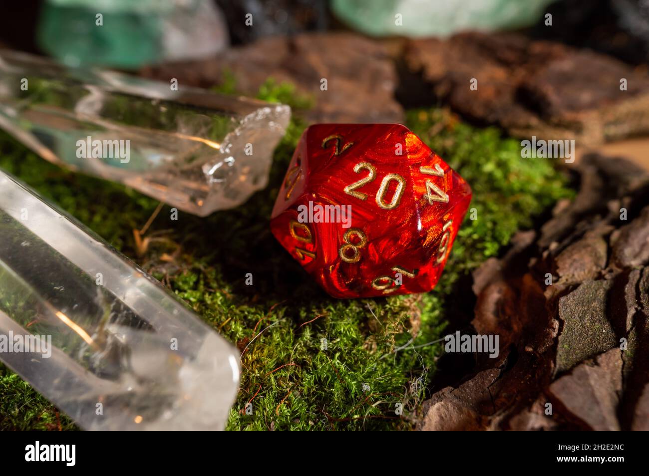 A close-up image of a red and gold marbled 20-sided role-playing gaming ...