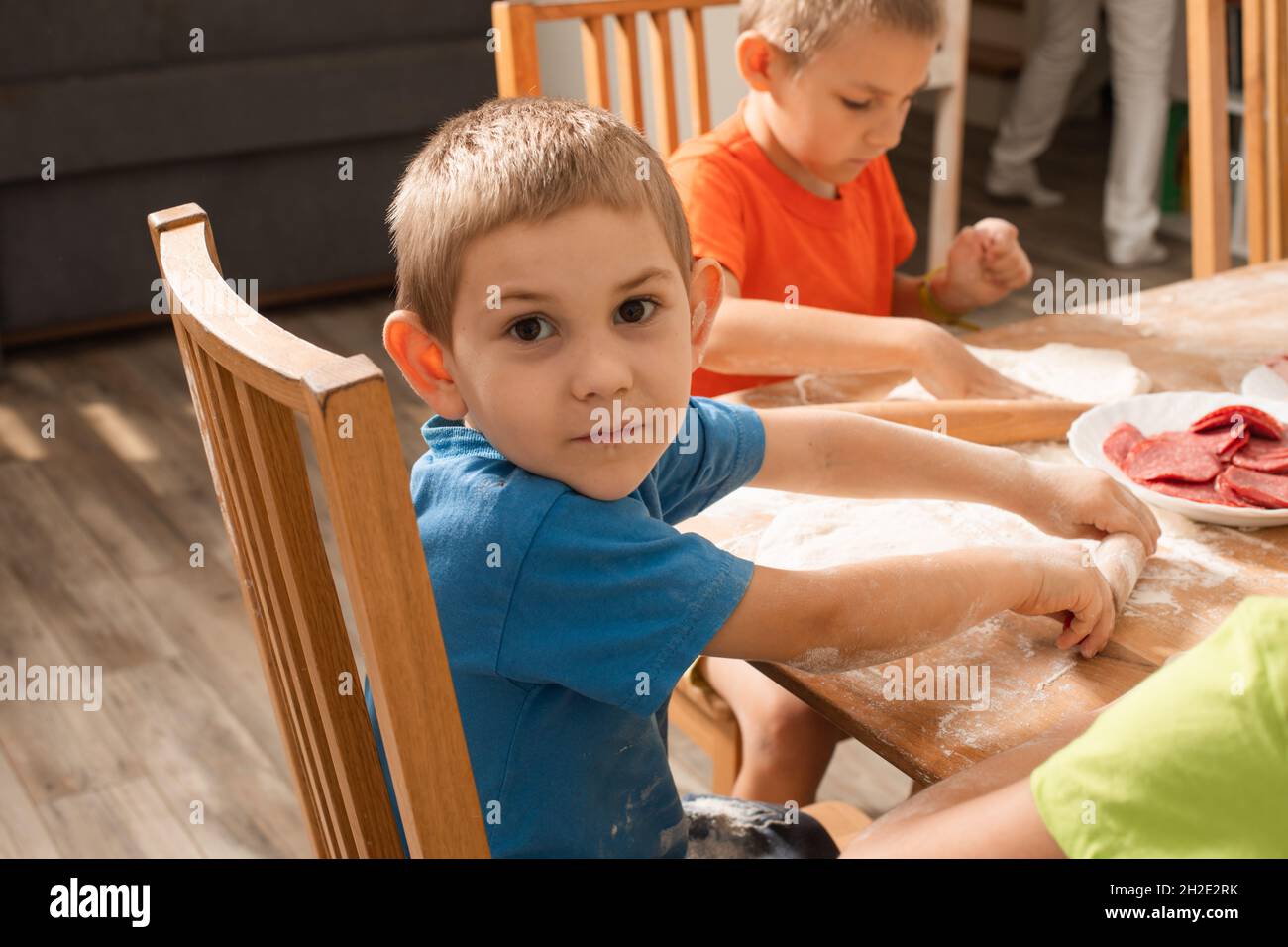 the little boy is preparing his favorite dish Stock Photo - Alamy