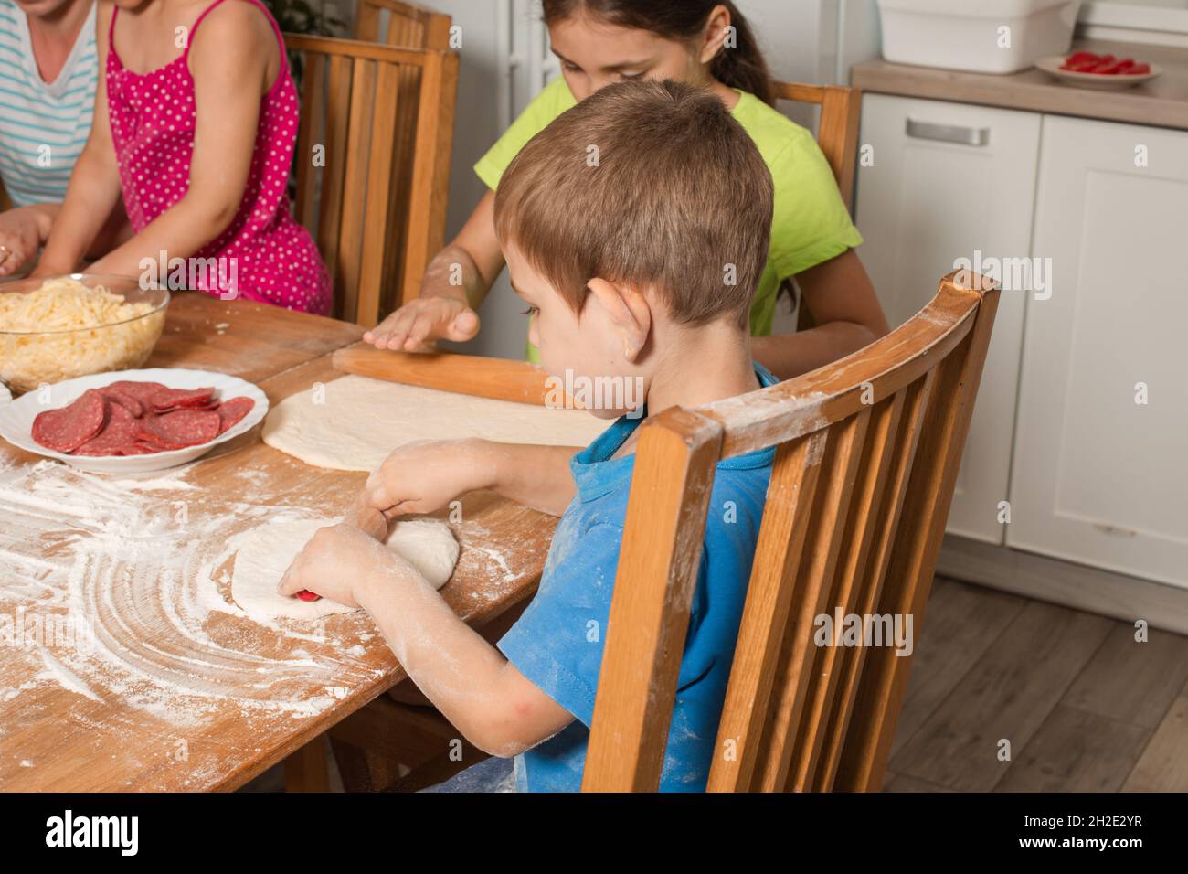 the little boy is preparing his favorite dish Stock Photo - Alamy