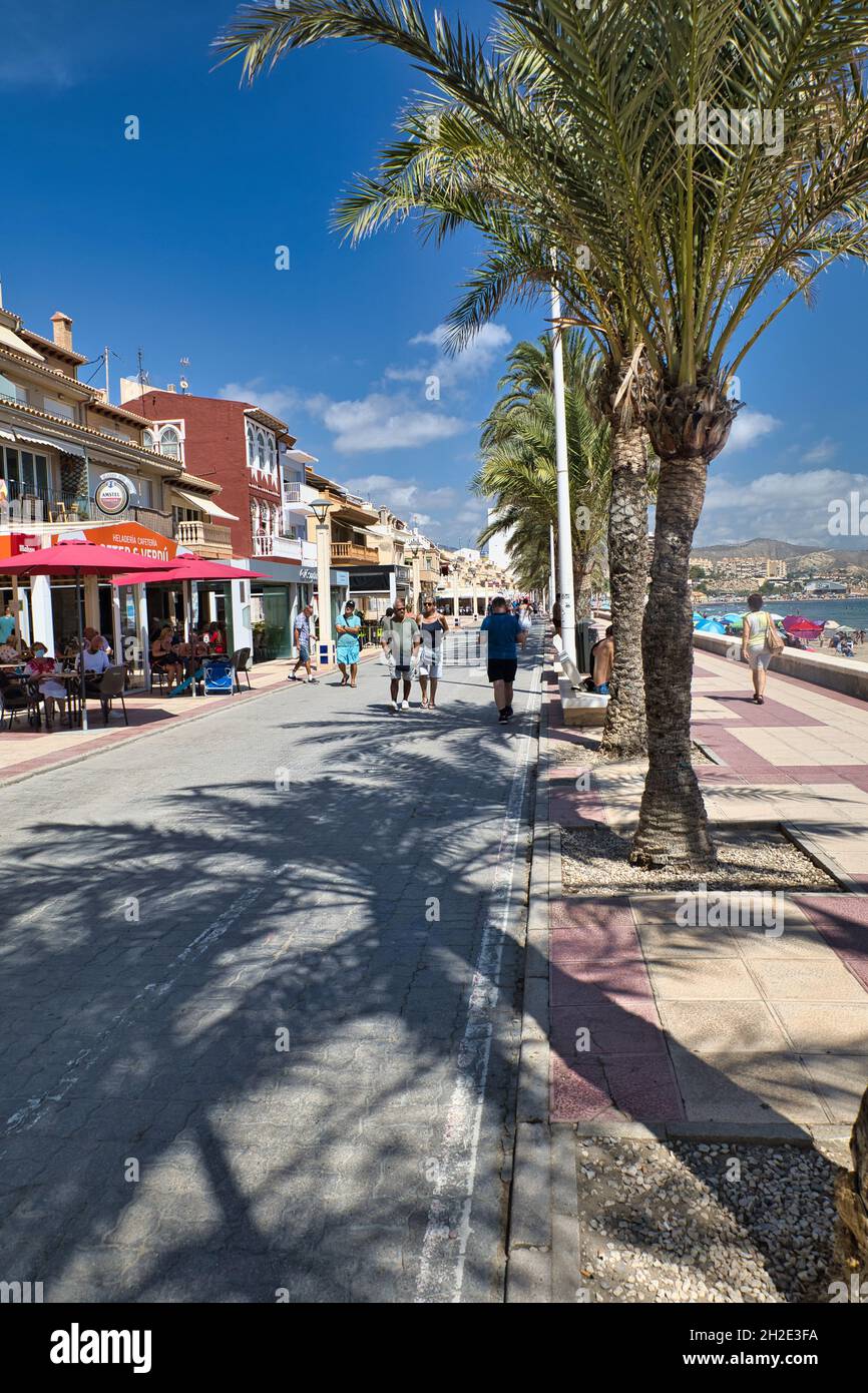 Spain, walkers on the seaside promenade of El Campello.Certical view ...