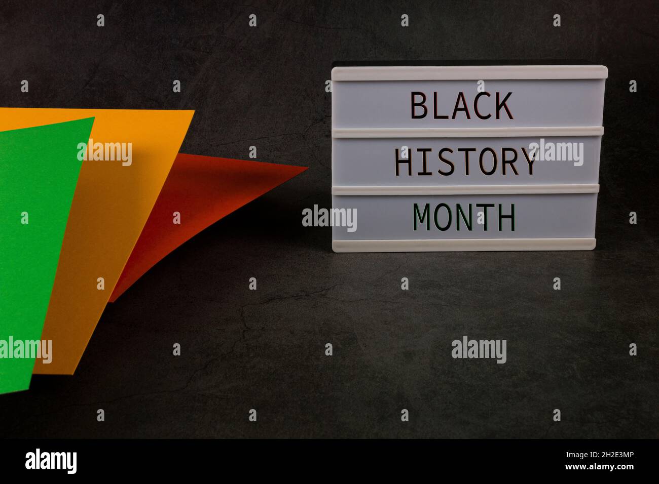 Black History Month. Red, yellow and green color paper on the black ...