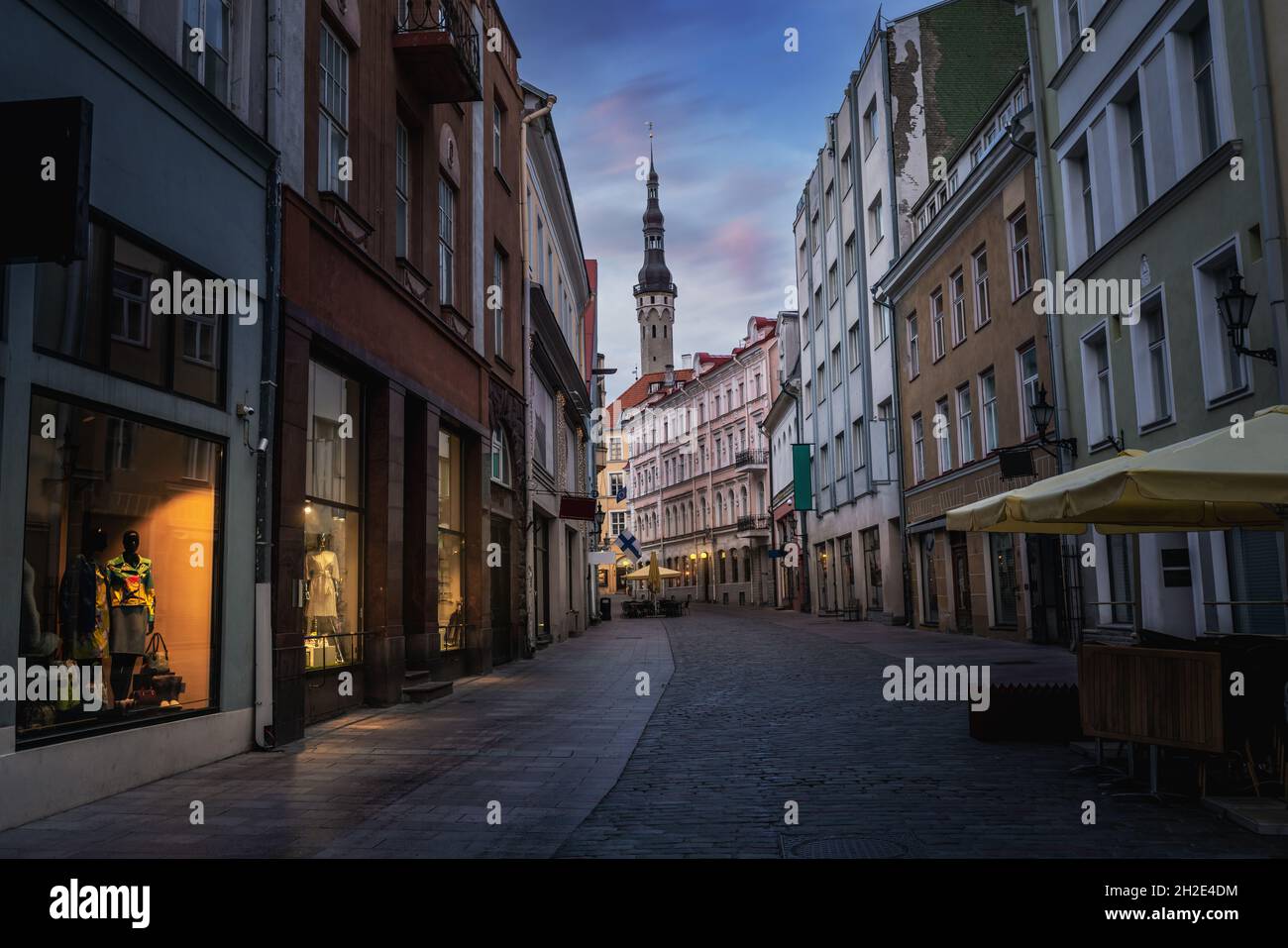 Tallinn old town Viru Street at sunset with Tallinn Town Hall Tower on ...