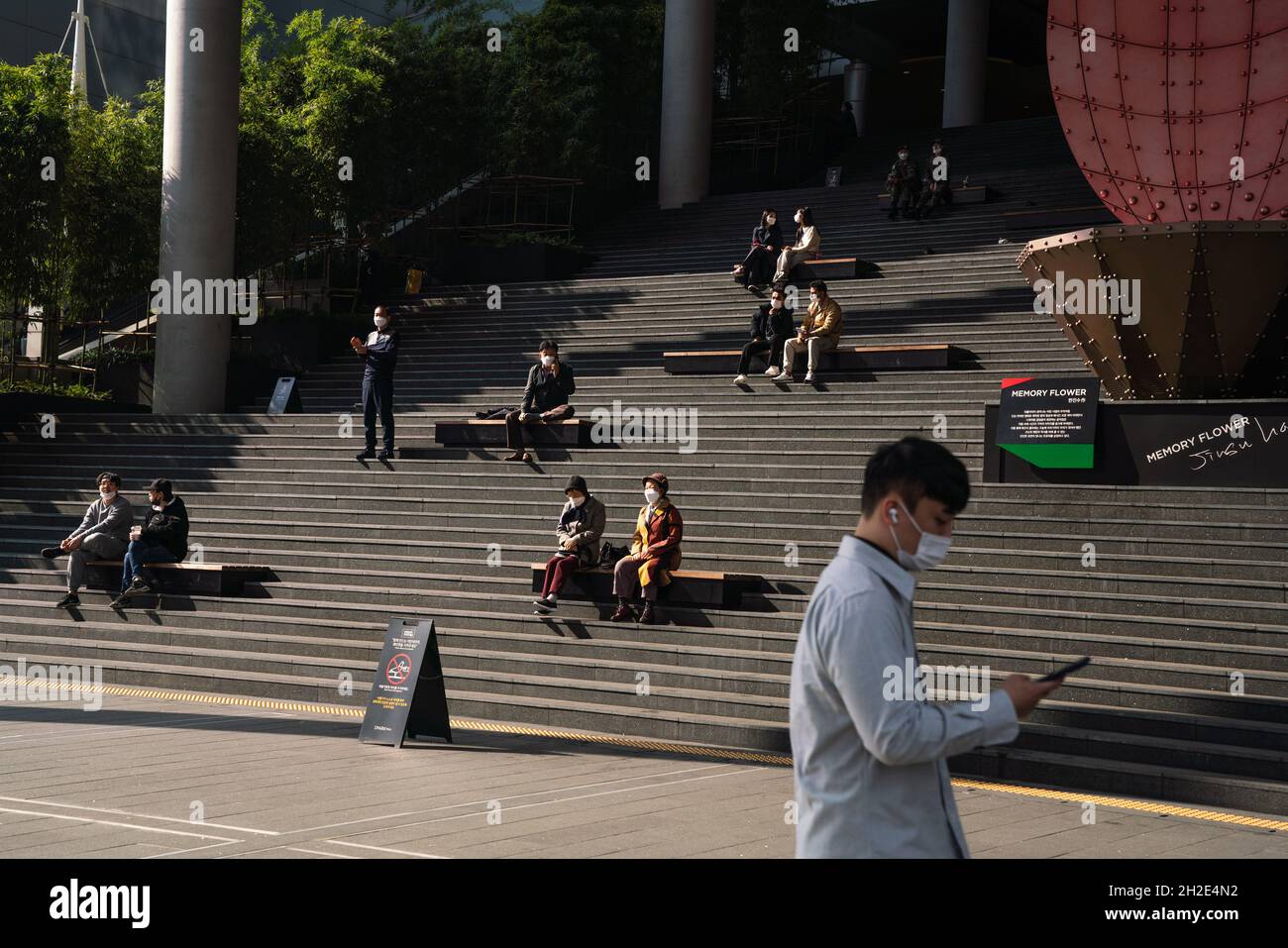 Seoul, South Korea. 21st Oct, 2021. People wearing masks sit on the ...