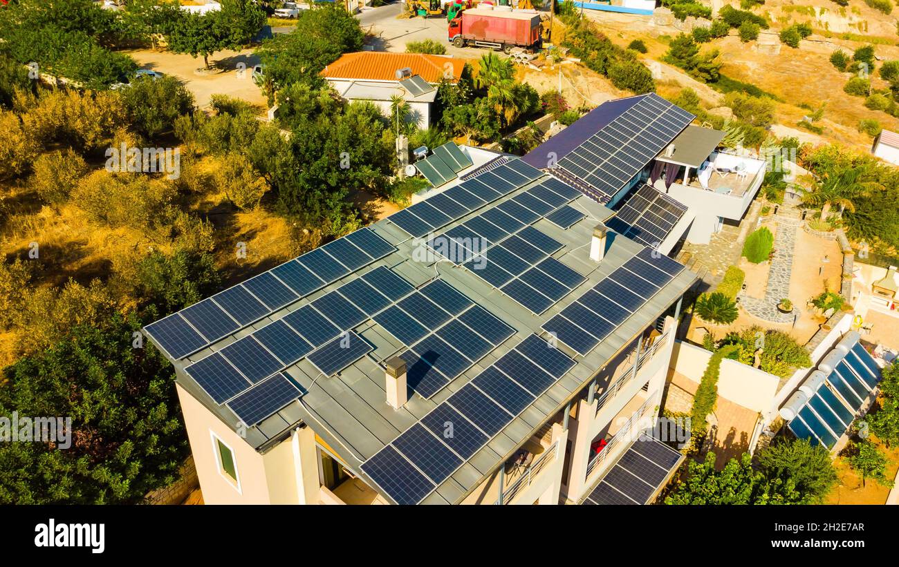 Home exterior with solar panels using sunlight as alternative ...