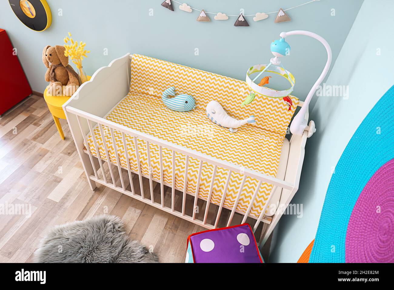 Interior of baby room with comfortable crib Stock Photo - Alamy