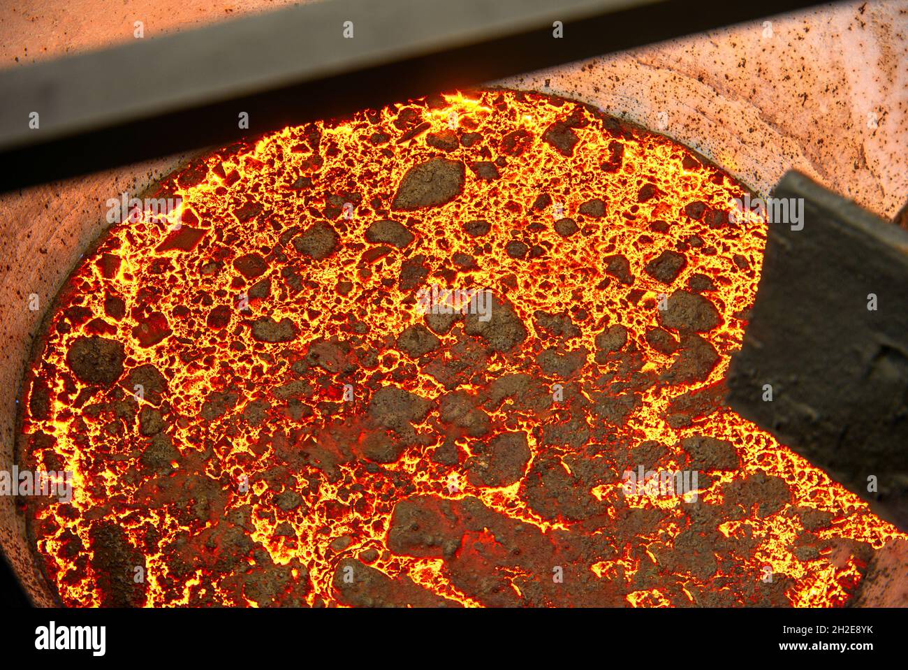The surface of a hot liquid slag in a metallurgical ladle. Thick crust ...