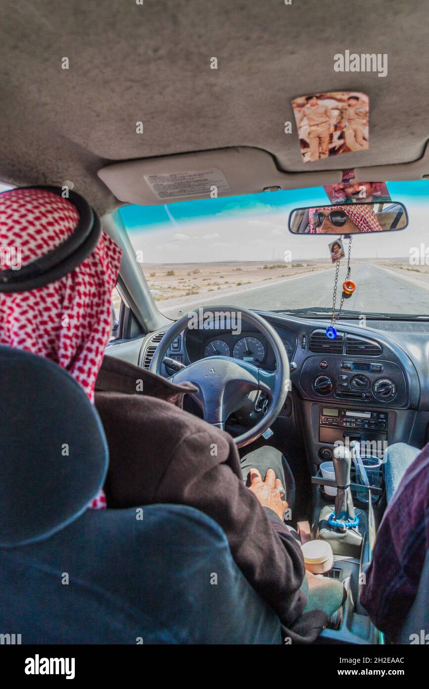 EASTERN JORDAN - APRIL 3, 2017: Local arab driver on the desert road in ...