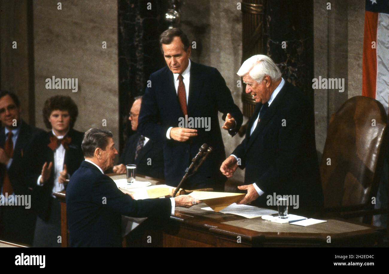 President Ronald Reagan. hands Speaker Tip O'Neal a copy of his State ...