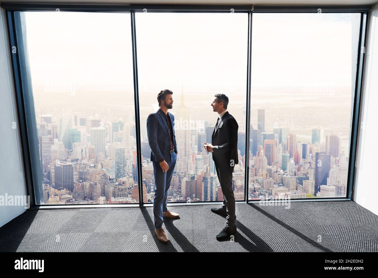 Talking business together Stock Photo - Alamy