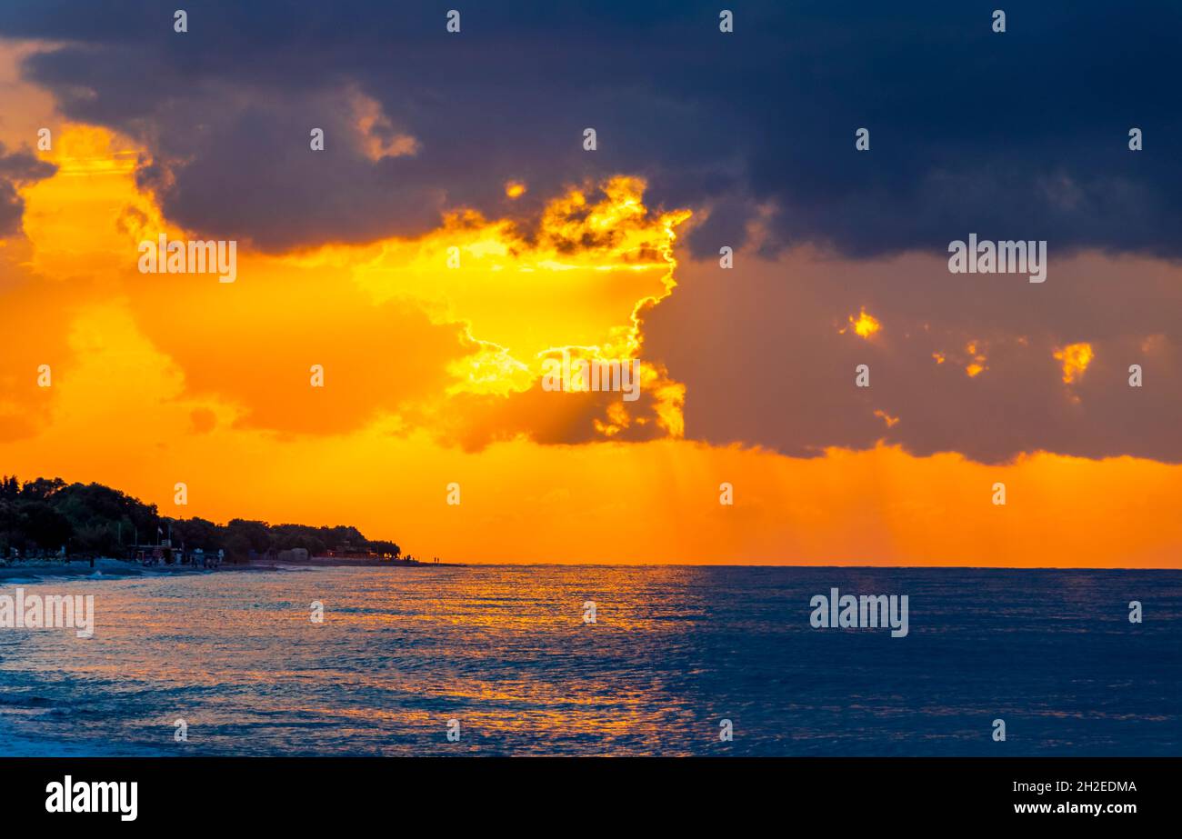 Golden colors of the most beautiful sunset at Ialysos Beach on Rhodes ...
