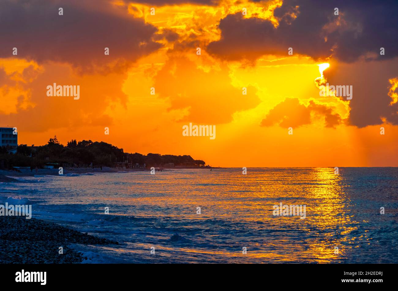 Golden colors of the most beautiful sunset at Ialysos Beach on Rhodes ...