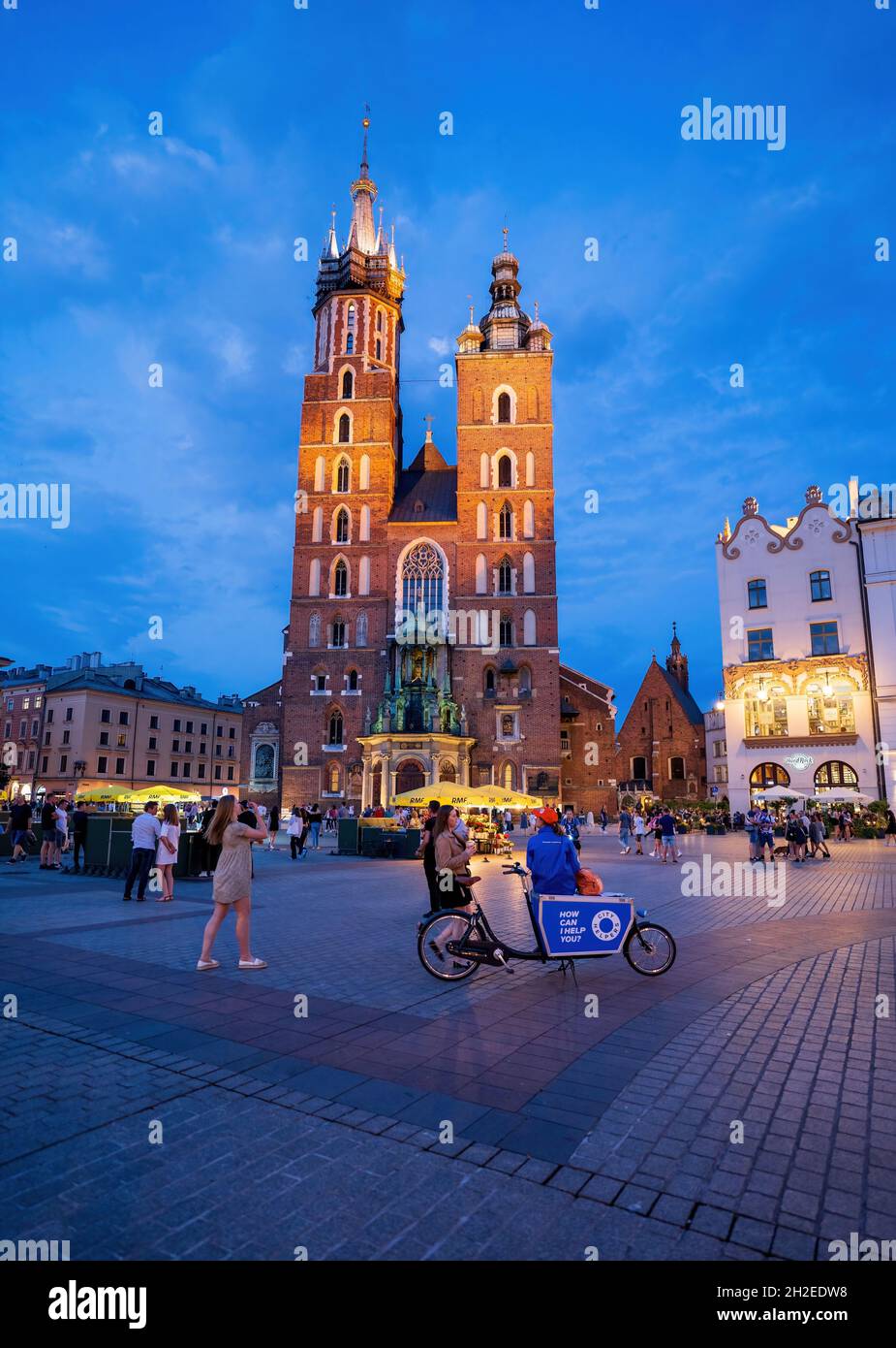 Krakow, Poland - July 23, 2021: A cart with may i help you sign against ...