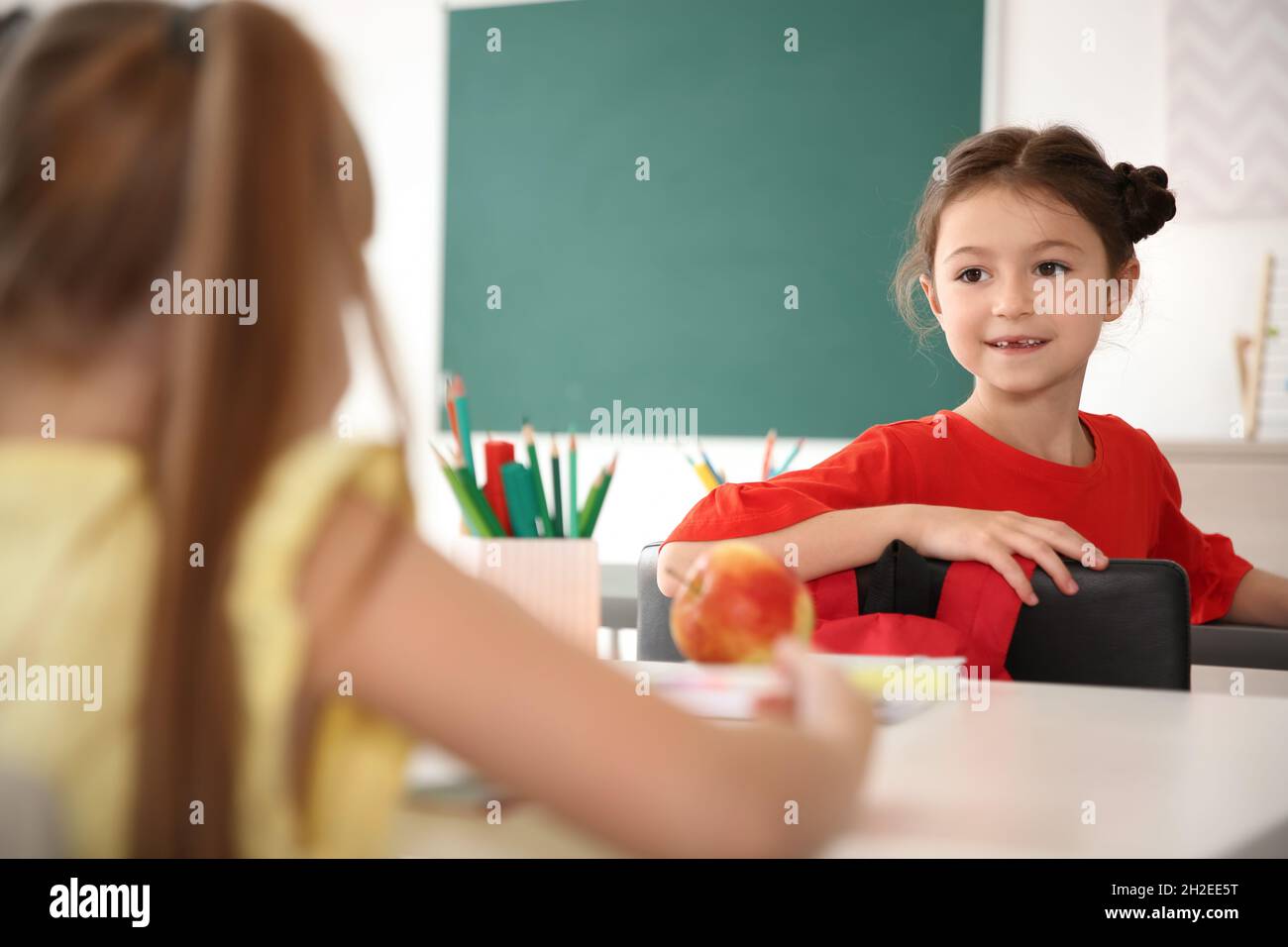 Cute little children in classroom. Elementary school Stock Photo - Alamy