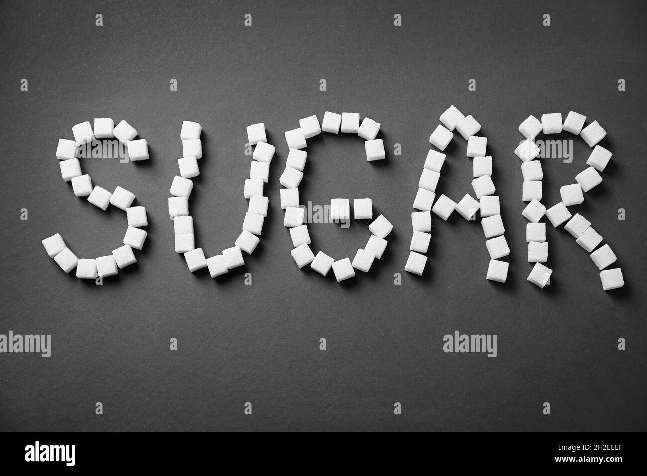 Sugar granulated word Black and White Stock Photos & Images - Alamy