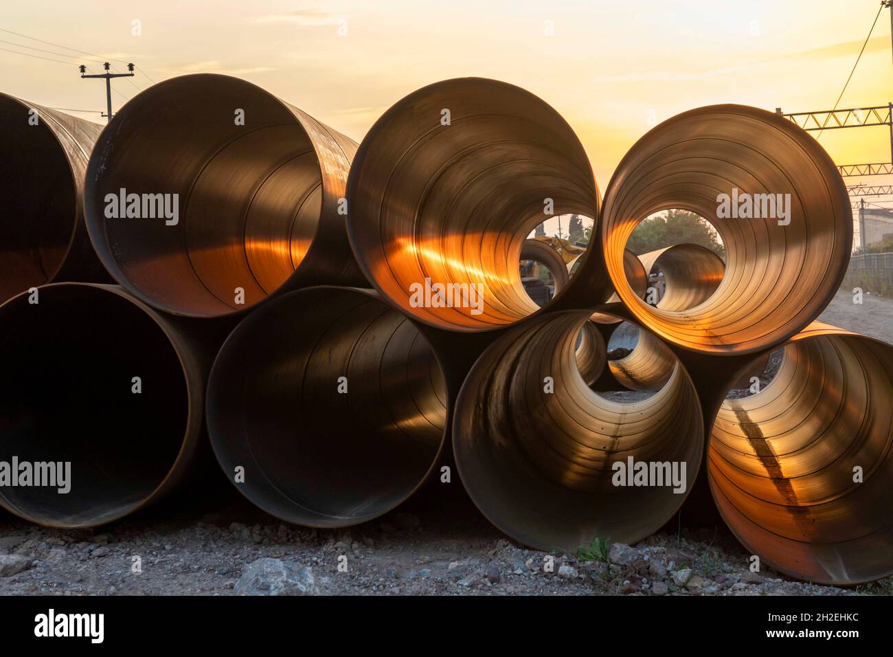 hollow large iron sewer pipes Stock Photo - Alamy
