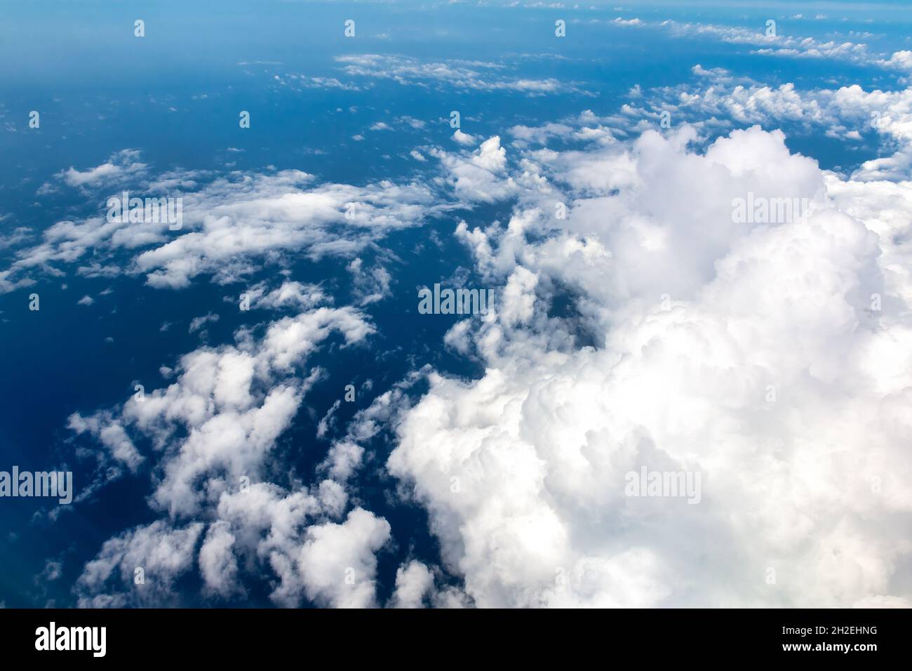 Beautiful clouds seen from aircraft in mid-air. The plane is flying ...