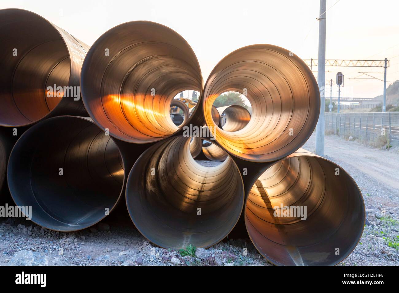 hollow large iron sewer pipes Stock Photo - Alamy