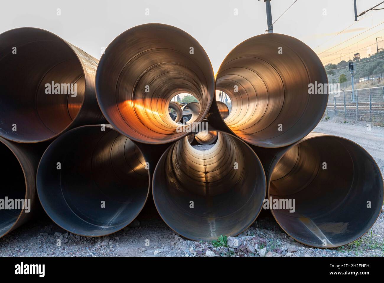 hollow large iron sewer pipes Stock Photo - Alamy