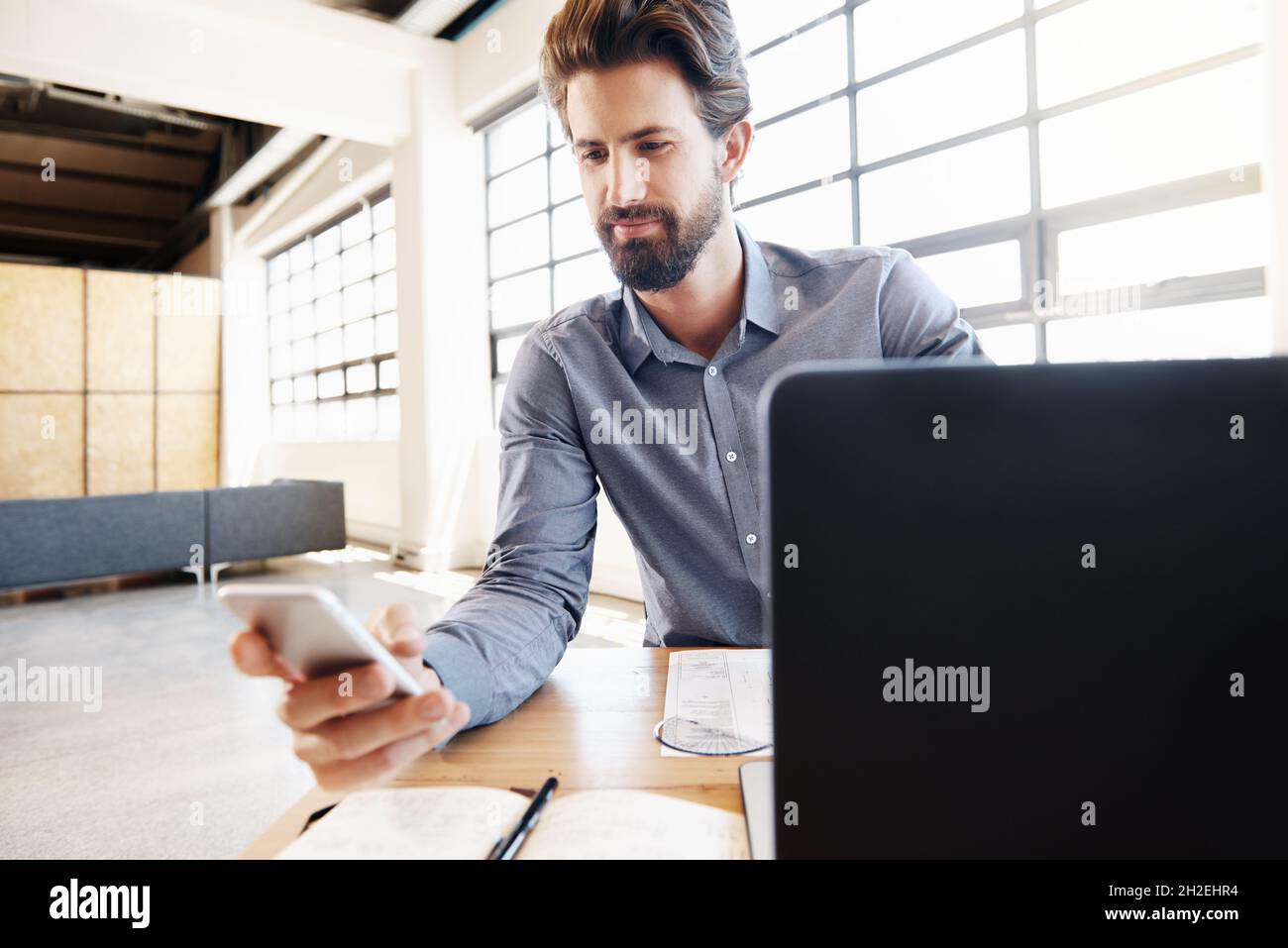 Receiving a text update Stock Photo - Alamy