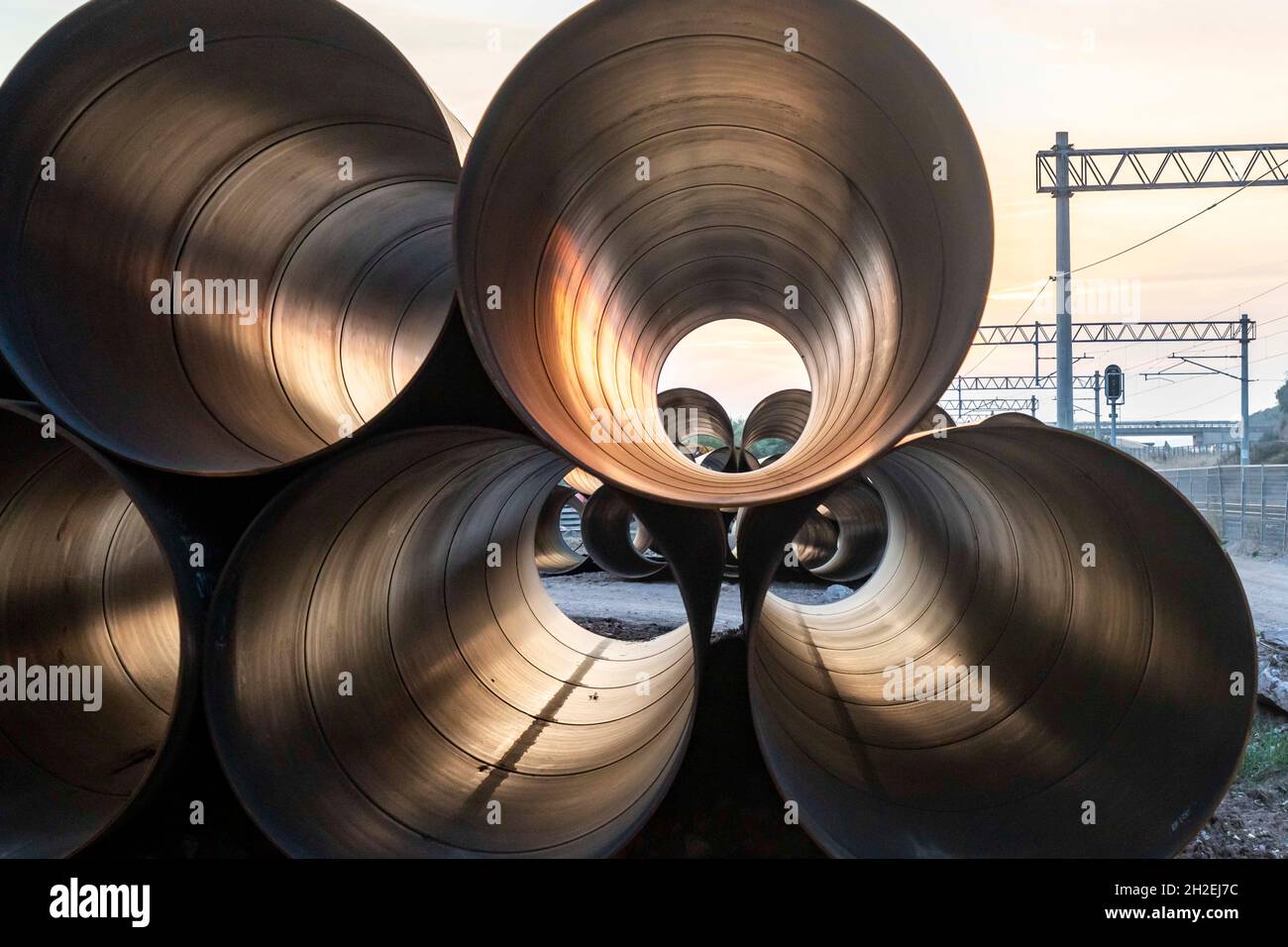 hollow large iron sewer pipes Stock Photo - Alamy