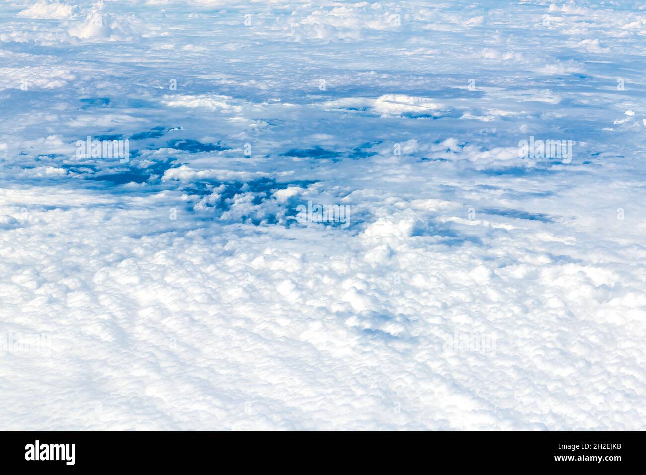 Beautiful clouds seen from aircraft in mid-air. The plane is flying ...