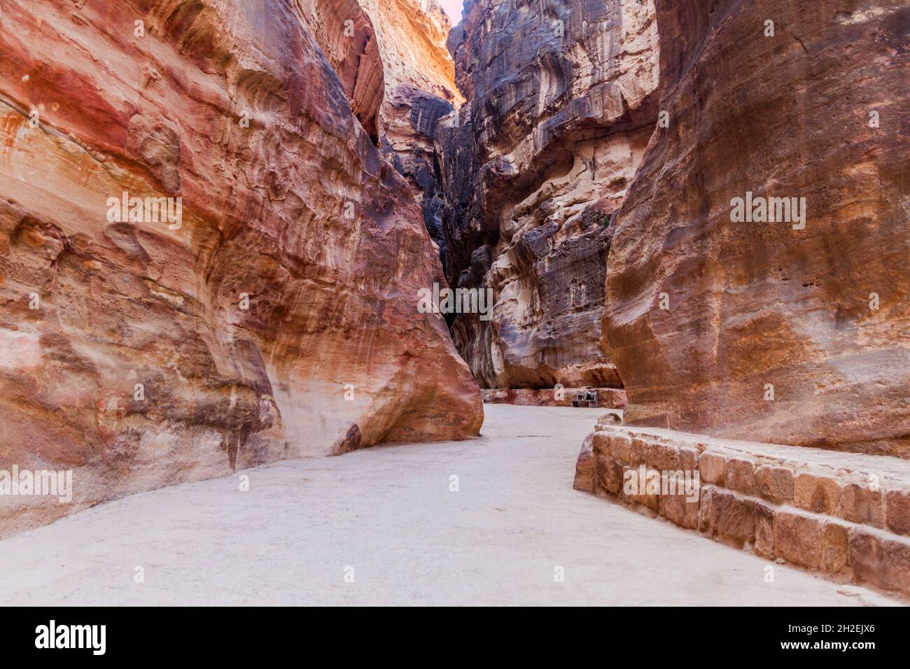The Siq, narrow gorge, main entrance to the ancient city Petra, Jordan ...