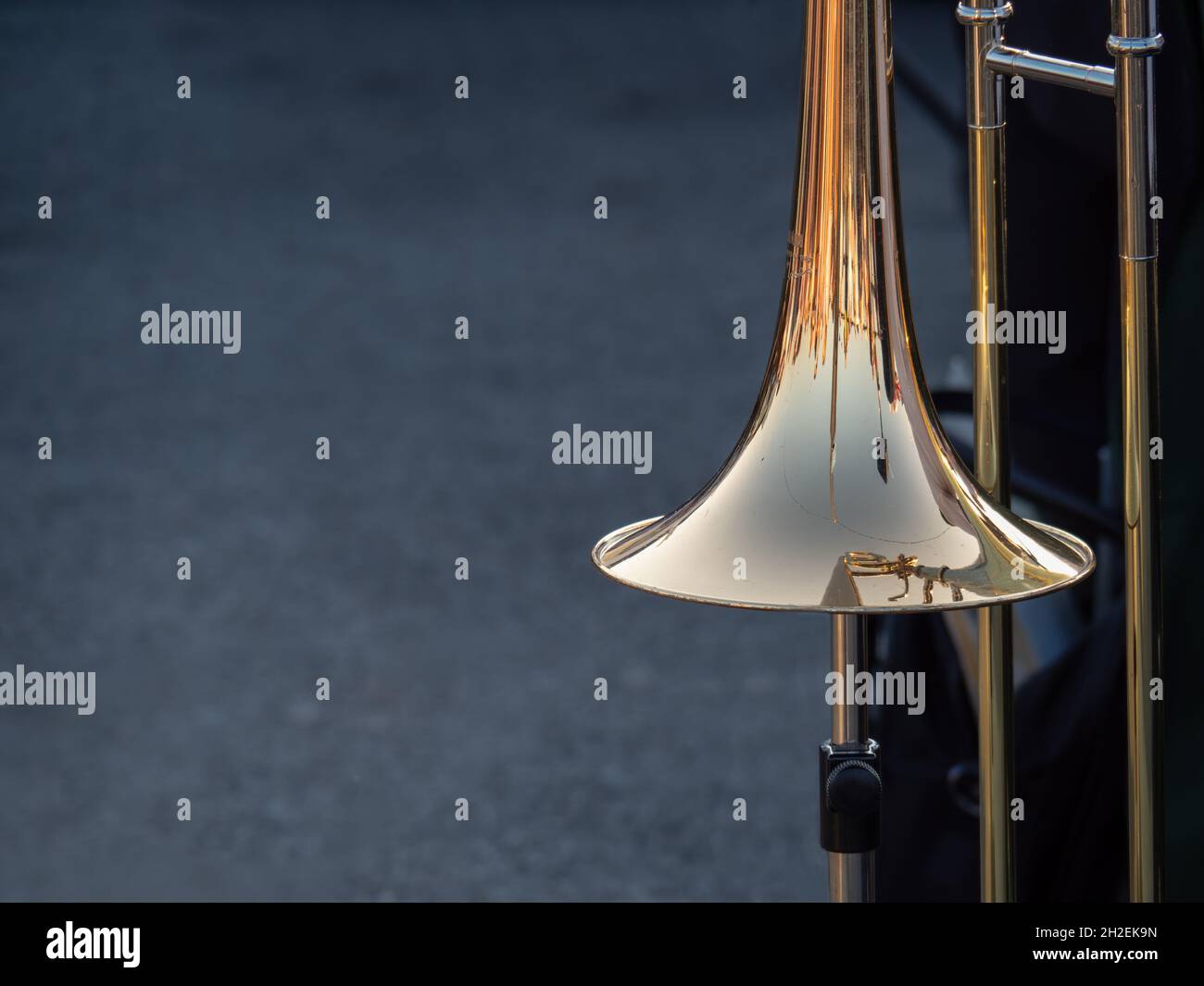 Trombone at rest over background for musical copy, copyspace Stock ...