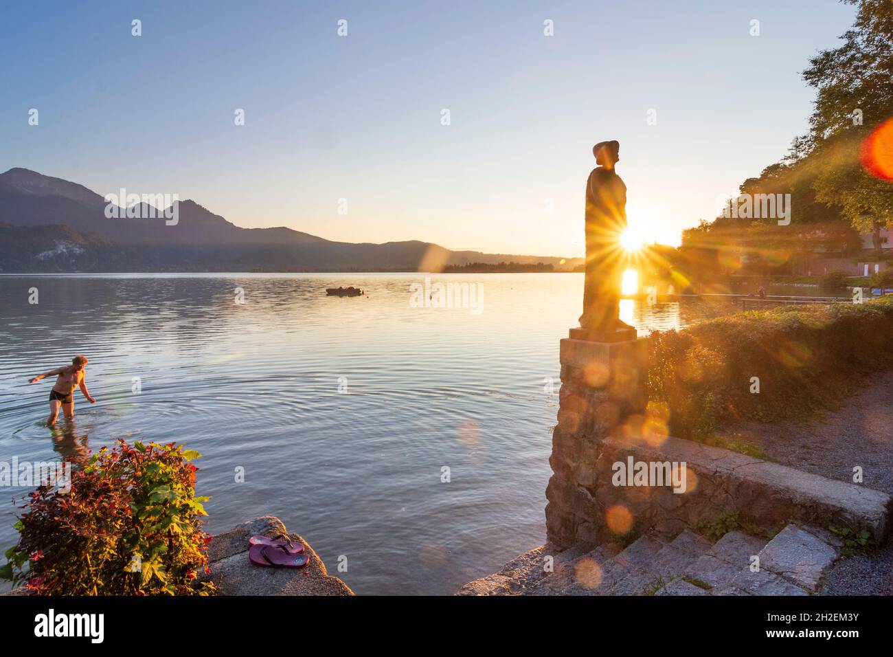 Kochel am See: Kochelsee (Lake Kochel), sunset, Fisherman statue, bather in Oberbayern, Upper ...