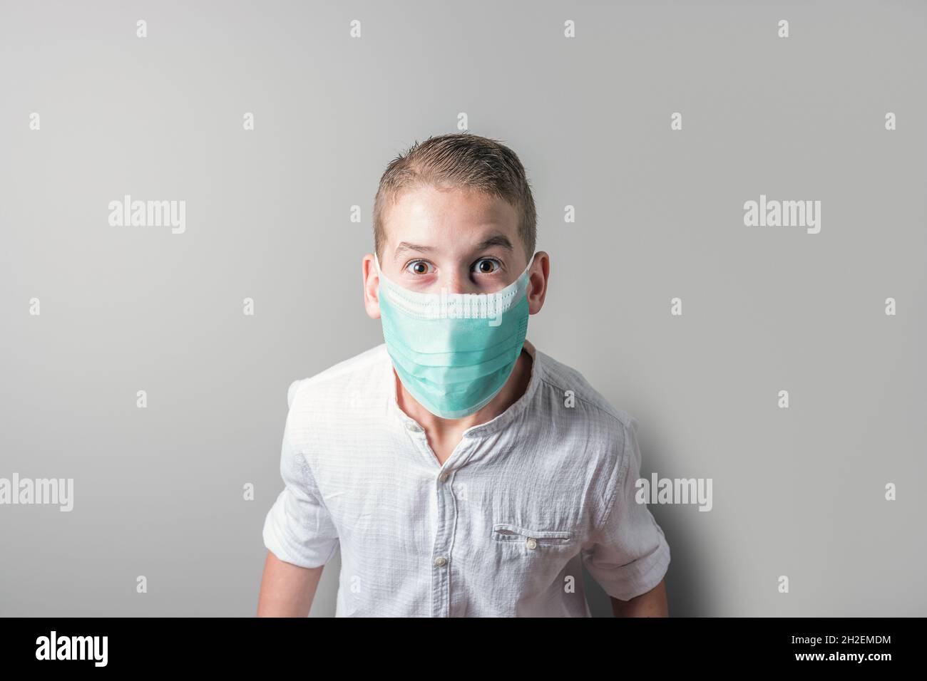 Screaming teenager boy in a white shirt on bright background Stock ...