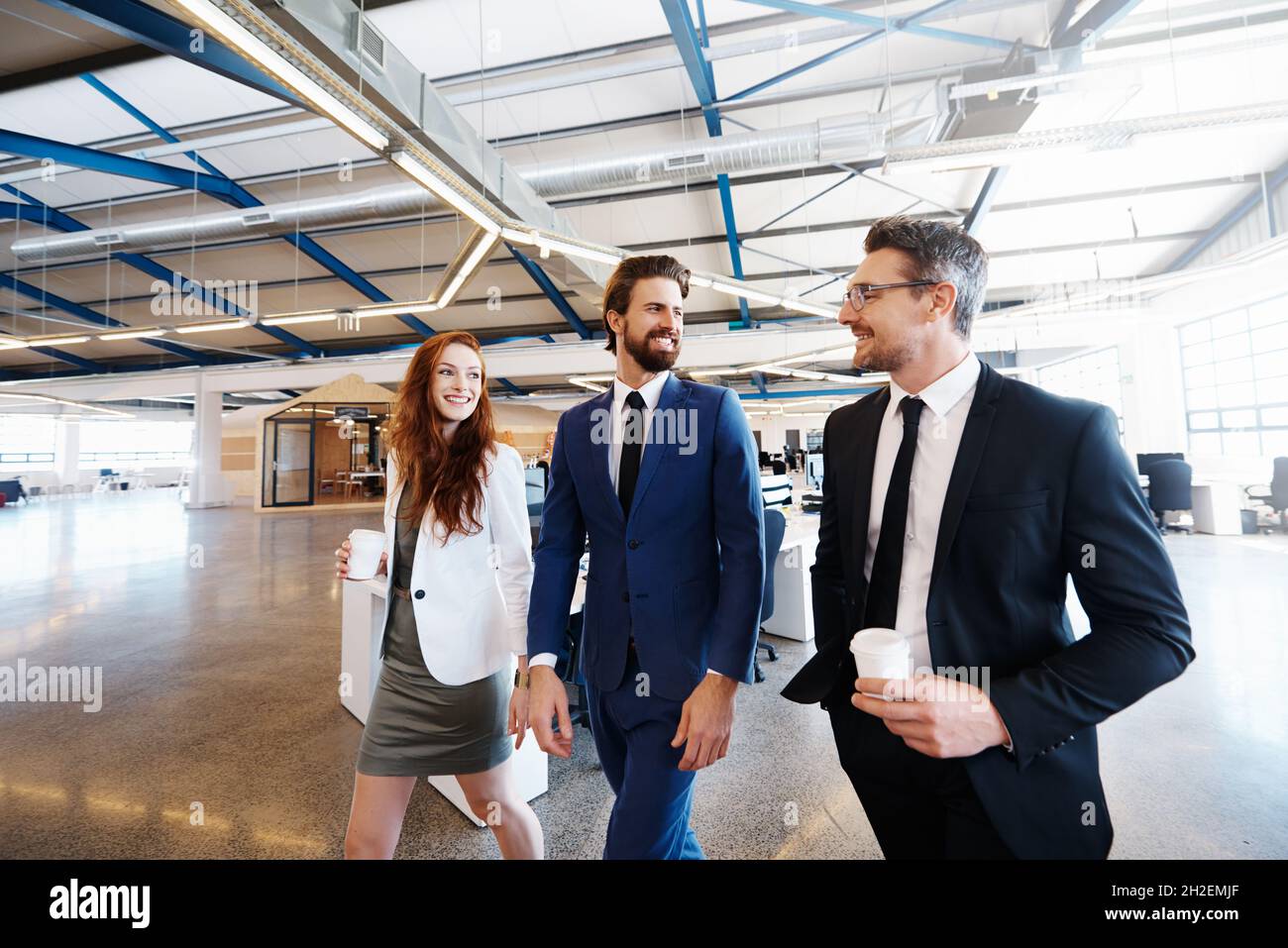 Walking his colleague through some updates Stock Photo - Alamy
