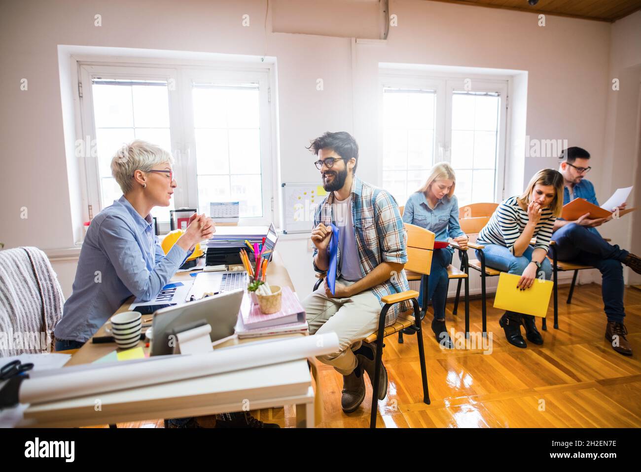 Young man on a job interview. Talking with hie future boss Stock Photo ...