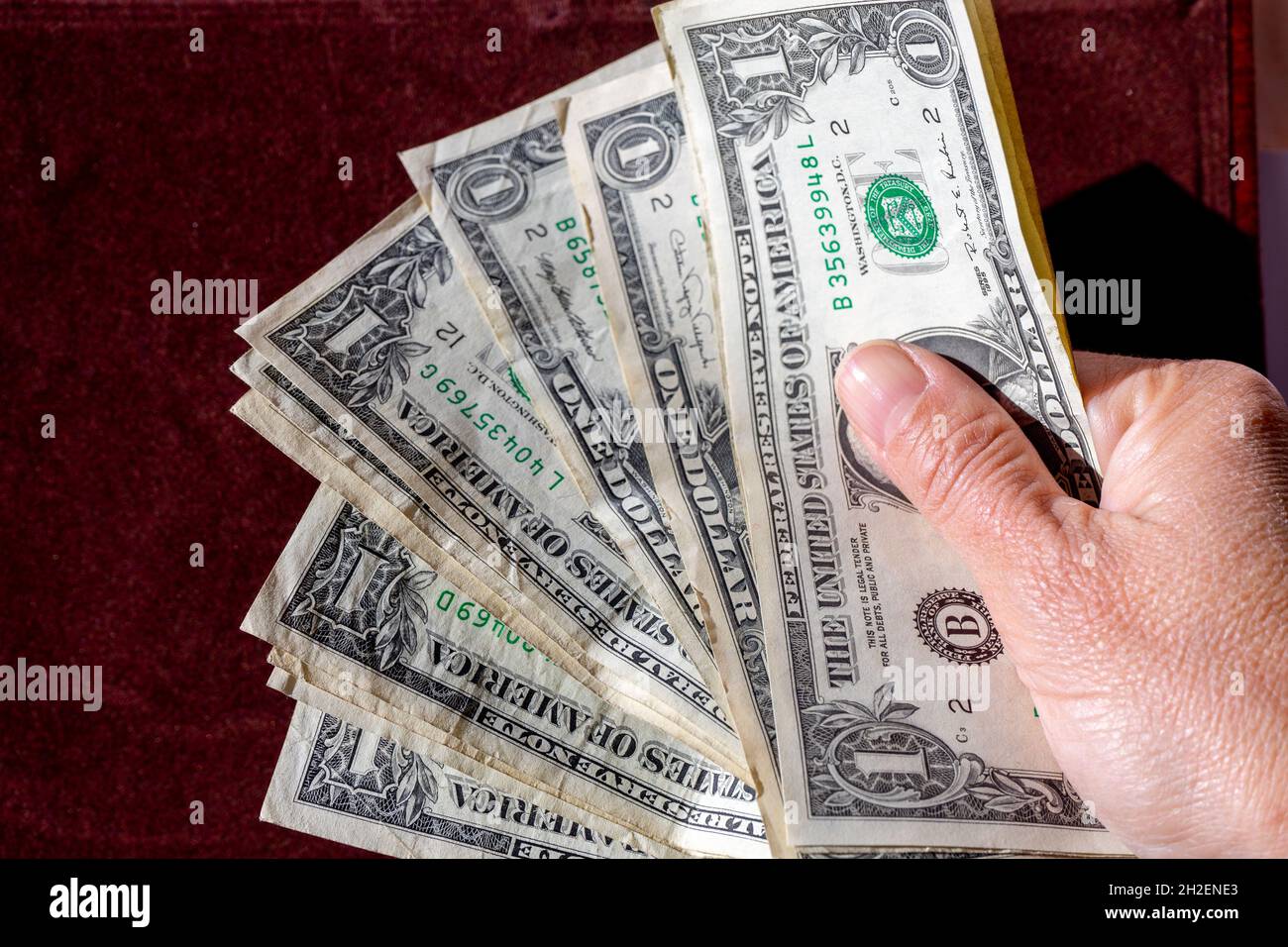 Hand heap money bills hi-res stock photography and images - Alamy
