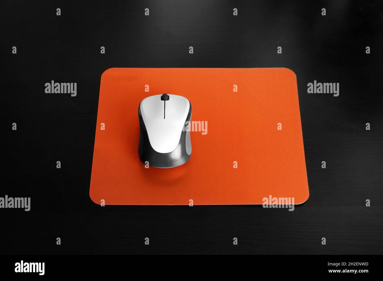 Blank pad and wireless computer mouse on black background Stock Photo ...