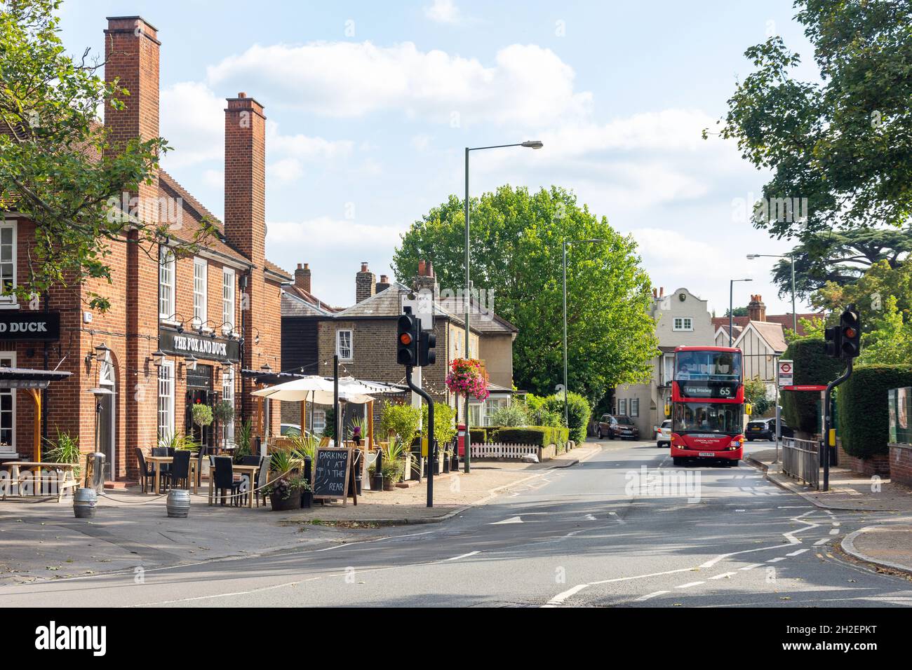 Local double decker bus street exterior facade flower baskets th hi-res ...