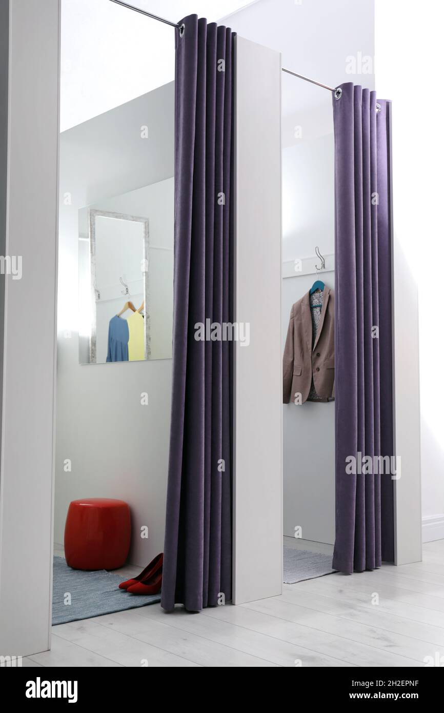 Empty dressing rooms in fashion store. Stylish interior Stock Photo - Alamy